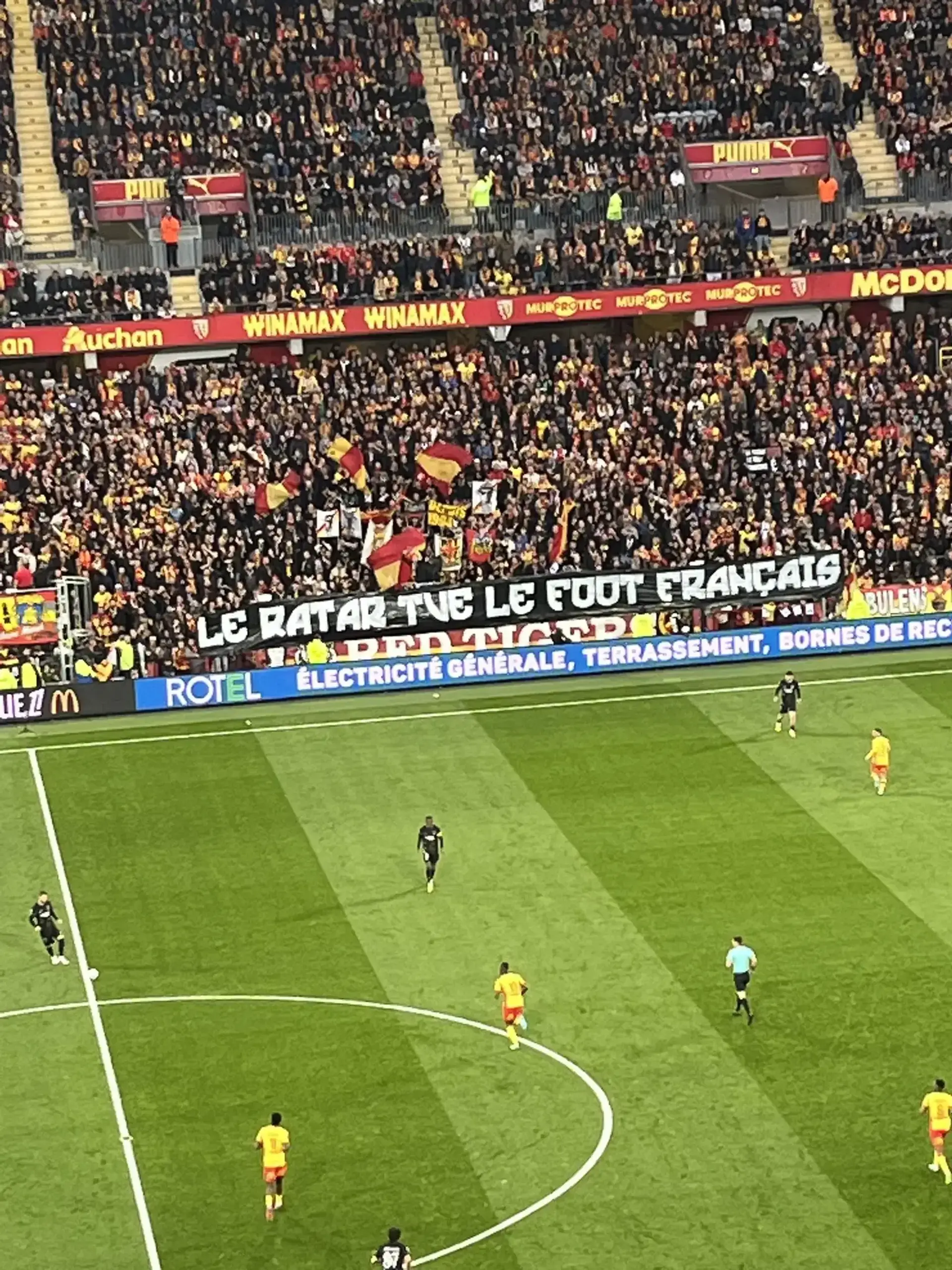 'Qatar kills French football': Lens fans display protest banners during ...