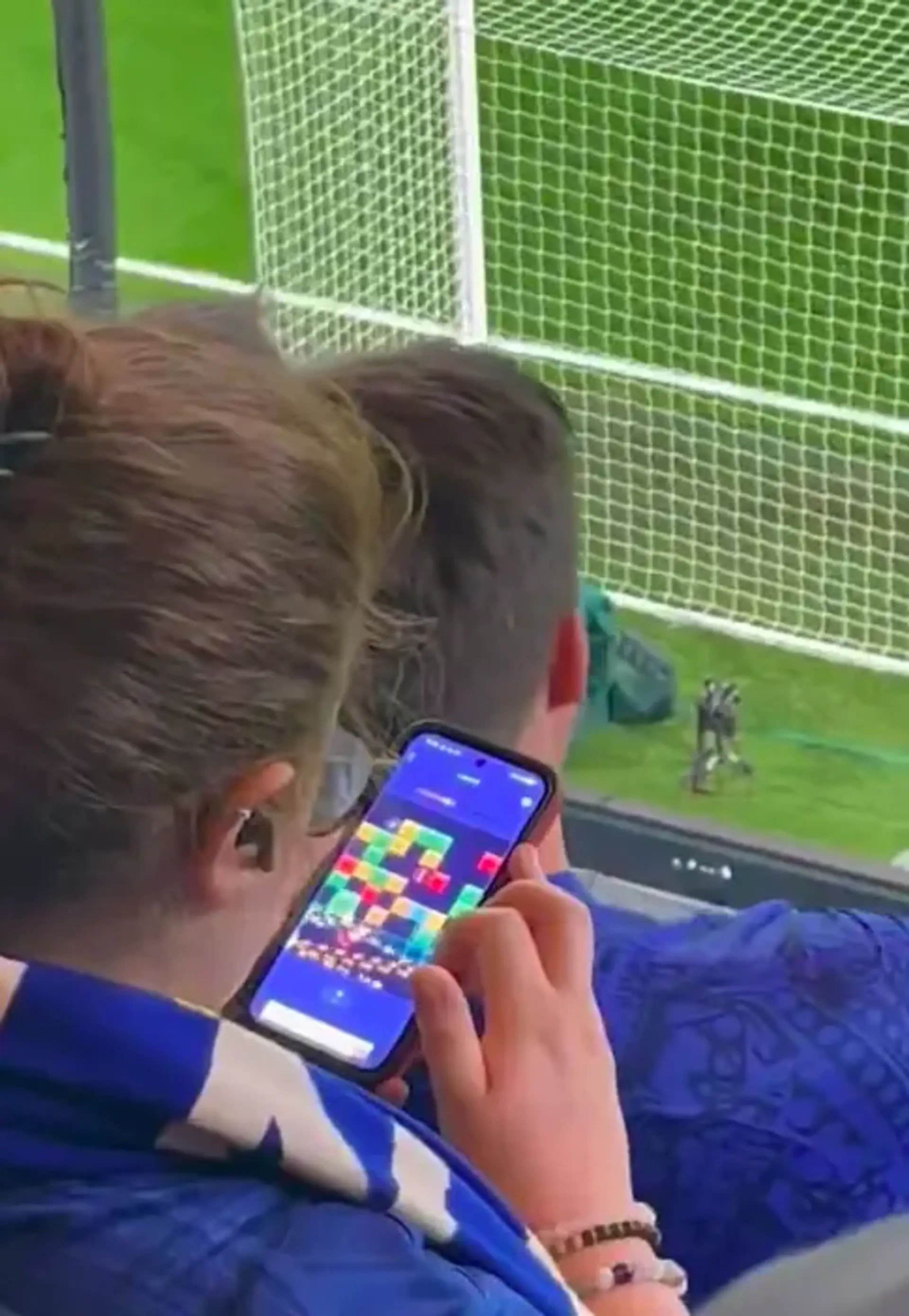 Chelsea fan goes viral for playing phone game during humiliating PSG ...
