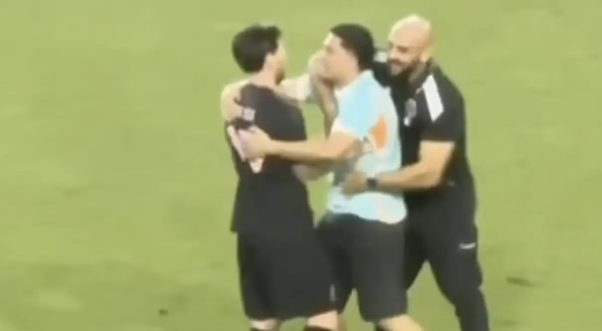 Fan knocks down Messi's bodyguard and hugs Argentine during friendly match